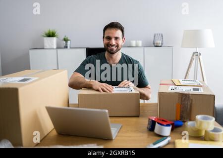 Person Packaging Orders For Online Retail Business Stock Photo - Alamy