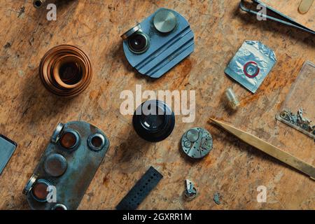 Vintage watchmakers tools on a wooden workbench Stock Photo - Alamy
