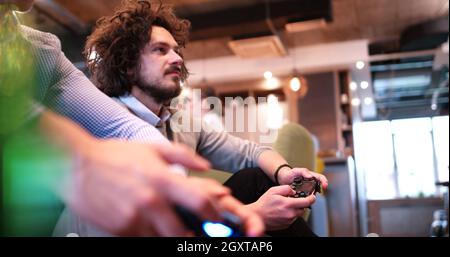 Work hard play hard. Office Workers Playing computer games Stock Photo ...