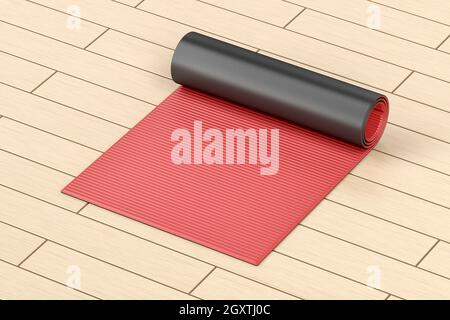 Half rolled yoga mat on wood floor Stock Photo - Alamy