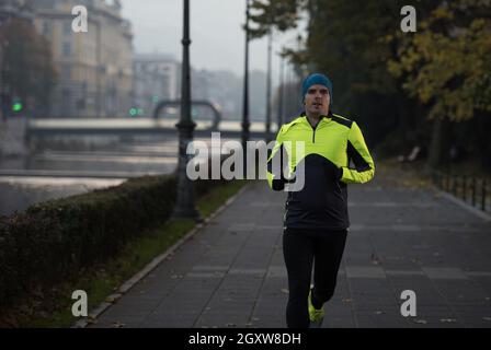 man jogging at cold autumn mornigng on steps Stock Photo - Alamy