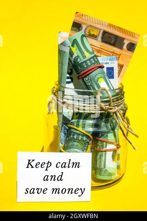 KEEP CALM AND SAVE MONEY Quote Female hand holding dollars close up ...