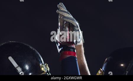 Happy Football Players Giving High Five At Field. Soccer Players High ...