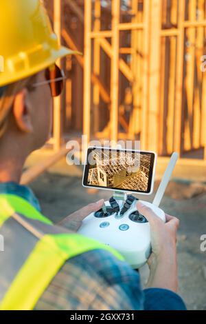 Female unmanned aircraft system (UAV) quadcopter drone pilot with ...