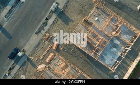 Aerial view the construction wood framing beams of a new house under construction Stock Photo ...