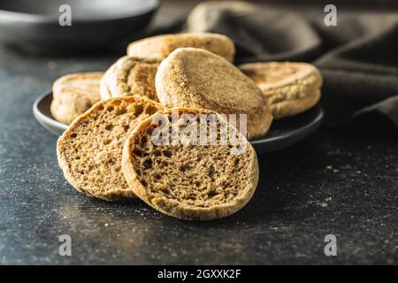 Toast bread buns on black table. Top view Stock Photo - Alamy