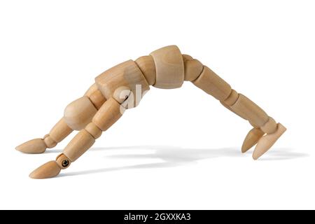 Wooden man doing gymnastic exercises Stock Photo - Alamy