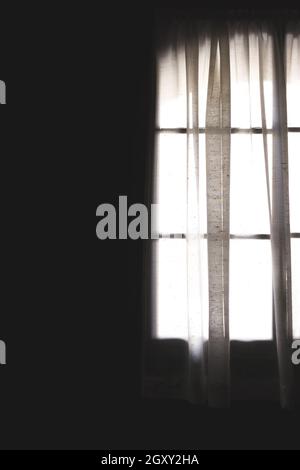 Lights shining through the window of a house at night Stock Photo - Alamy