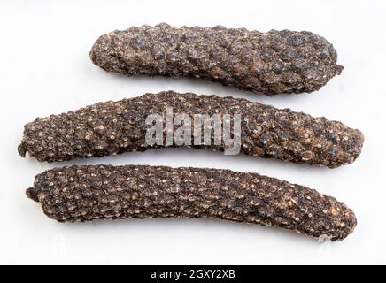 few java long peppers close up on gray ceramic plate Stock Photo - Alamy