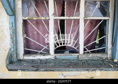 Windows with the broken glasses. The old thrown gas station Stock Photo ...