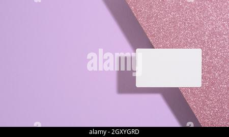 blank rectangular business card lies on a modern pink background sheets ...