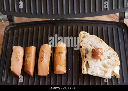 preparing toast made with bread wurstel and mixed green salad Stock ...