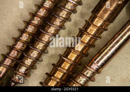 Brass screws with thread under a magnifying glass Stock Photo - Alamy