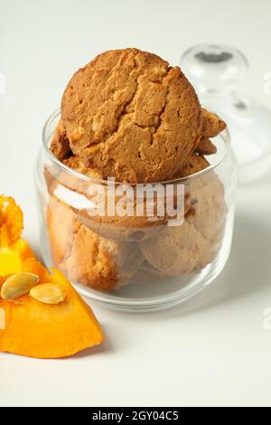 Jar with pumpkin cookies on white background Stock Photo - Alamy