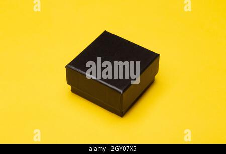 Mini black box product packaging isolated on yellow background Stock ...