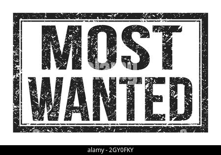 MOST WANTED, words written on black rectangle stamp sign Stock Photo ...