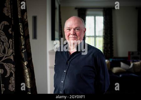 Sir Bernard Gray poses for a portrait at home in Bowden, UK Stock Photo ...