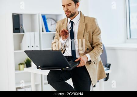 man in beige jacket official documents work office executive Stock ...