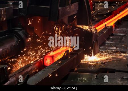 The process of rolling hot rolled steel in a rolling mill Stock Photo ...