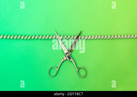 Phone cord being cut by scissors. Concept disconnected communication ...