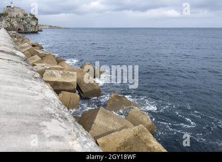 Detail of old cement dam on a beach in Spain Stock Photo - Alamy