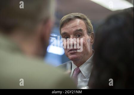 Sen. Mark Warner, D-Va., speaks with reporters at the Capitol Subway on ...