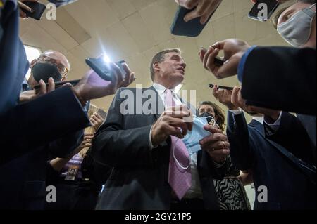 Sen. Mark Warner, D-Va., speaks with reporters at the Capitol Subway on ...