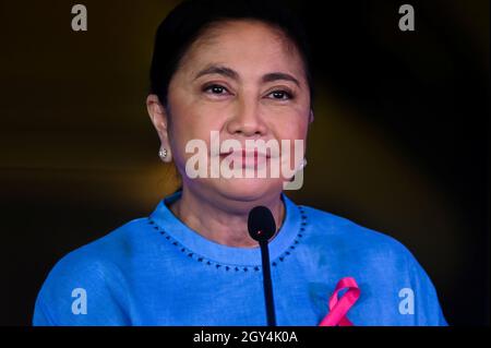 Philippine Vice President Maria Leonor "Leni" Robredo, center, leads ...