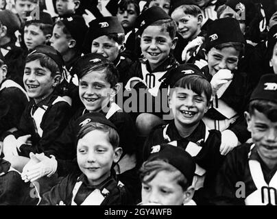 Boys of the Balilla, a fascist youth group, learning to load small ...