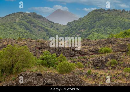 the road that climbs up the Etna volcano Stock Photo - Alamy