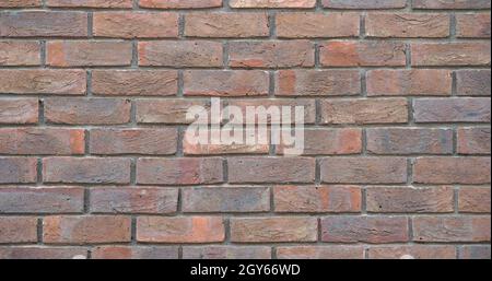 wide 4K red brick wall useful as a background Stock Photo - Alamy