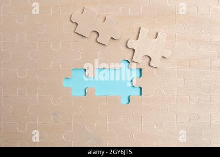 Building An Unfinished White Jigsaw Pattern Puzzle With Missing Last ...