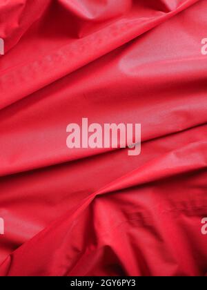 rippled red polyester fabric texture useful as a background Stock Photo ...