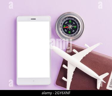 World Tourism Day, minimal toy model plane, compass and face mask ...