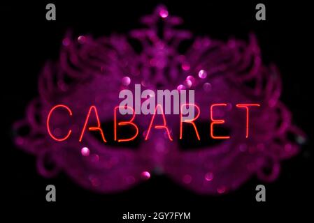 Vintage Neon Cabaret Sign With Bokeh Carnival Mask Stock Photo - Alamy