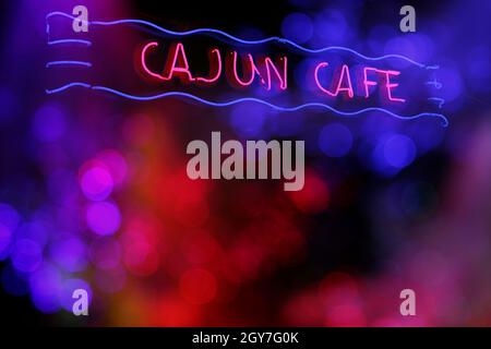 Vintage Neon Cajun Cafe Sign on Restaurant Wall Stock Photo - Alamy