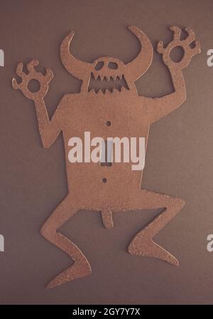 Traditional american ethnic sculpture of a devil. White background ...