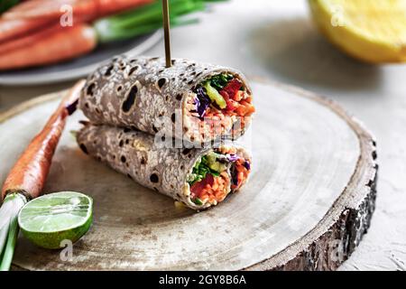 Mango Carrot Sprout and Hummus with Sweet Purple Tortilla wrap Stock ...