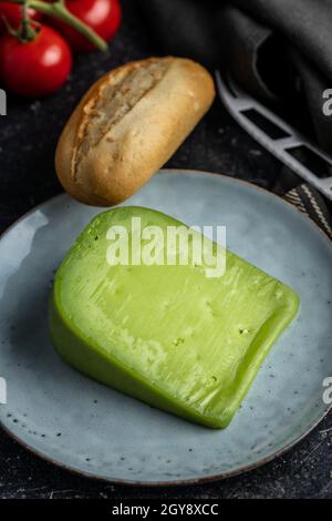 Block of hard cheese with wasabi flavor isolated on white background ...
