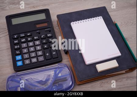 Blank Notebook Page With A Calculator And Geometric Stationery Over ...