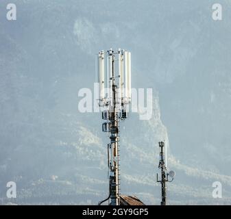 Communication transmitter on the rooftop of a house Stock Photo - Alamy