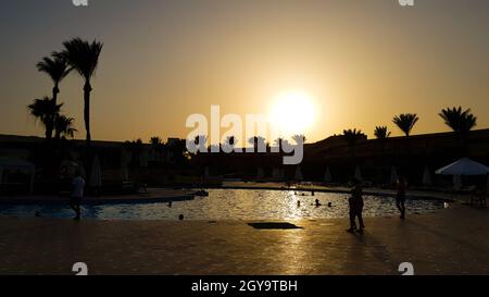 Gorgeous view of hotel's recreation area with outdoor pool, sun ...