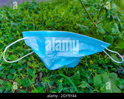 Surgical blue masks in nature. Corona virus pollution. Covid19. Corona ...