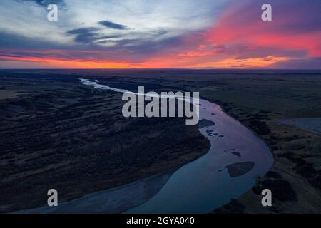 Neon Red Sunset Over Red Deer River Stock Photo - Alamy