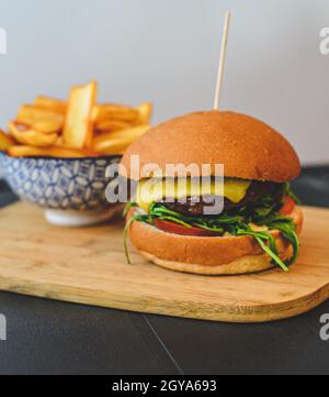 Beef burger with cheddar cheese bacon and crispy onions Stock Photo - Alamy