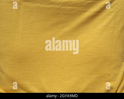 yellow cotton fabric texture useful as a background Stock Photo - Alamy