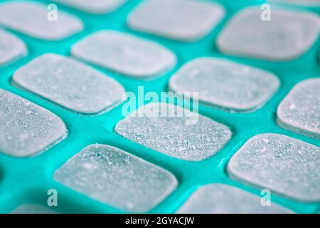 ice cubes in green silicone mold Stock Photo - Alamy