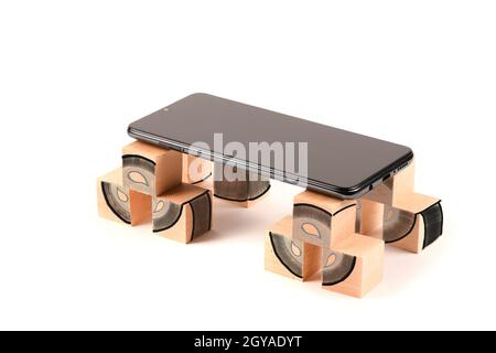 Smartphone on wheels isolated on white background Stock Photo - Alamy