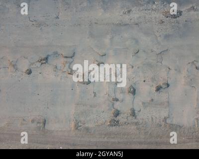 Poor condition of the road surface. Pits and potholes with cracks in ...