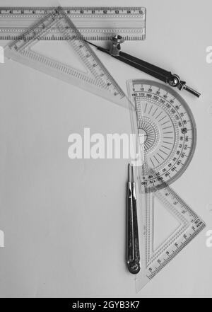 Protractor on graph paper background Stock Photo - Alamy